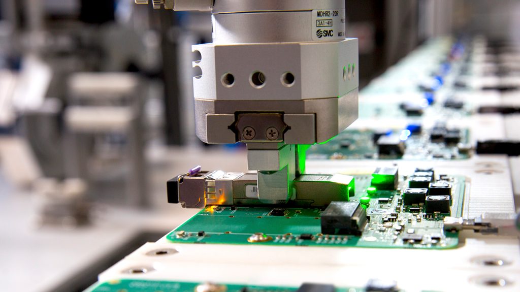 Small Form-factor Pluggable transceiver being installed on an SFP board ...